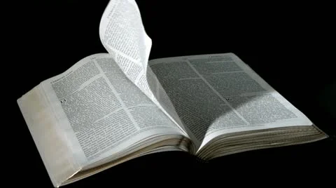 Bible pages turning in the wind on black... | Stock Video | Pond5