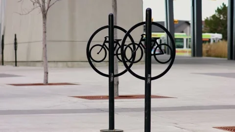 Bicycle parking pole in plaza | Stock Video | Pond5