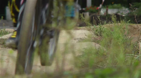 Bicycle riders test track for BMX challe... | Stock Video | Pond5