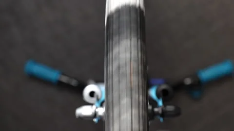 bicycle wheel spinning against a dark bl... | Stock Video | Pond5