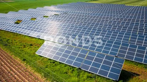 Big and blue photovoltaic farm as zero emission energy. Stock Photo ...