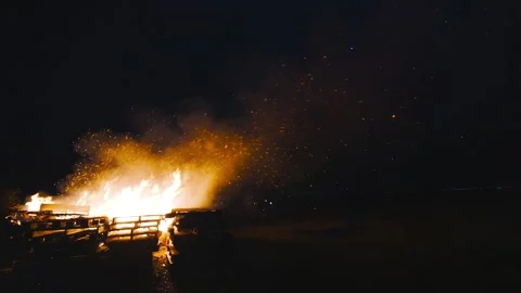 Big campfire with sparks/ particles/ ash... | Stock Video | Pond5