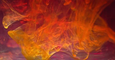 Big cloud of yellow ink is falling down ... | Stock Video | Pond5