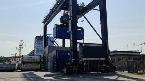 Big container crane moving cargo at the ... | Stock Video | Pond5