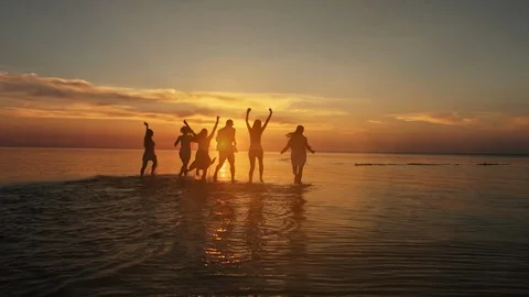 Big crowd of friends having fun at sunse... | Stock Video | Pond5