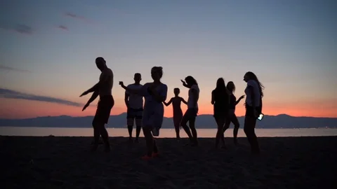 Big crowd of friends having fun at sunse... | Stock Video | Pond5