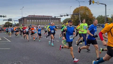 big crowd of runner is running past Turu... | Stock Video | Pond5