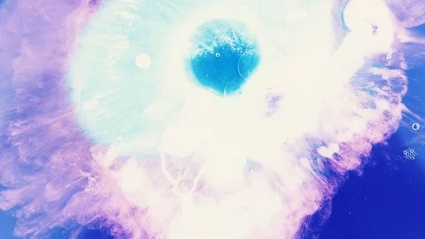 big explosion of blue liquid in a violet... | Stock Video | Pond5