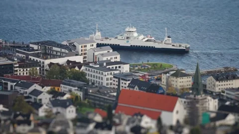 A big ferry is docking at the Molde port... | Stock Video | Pond5