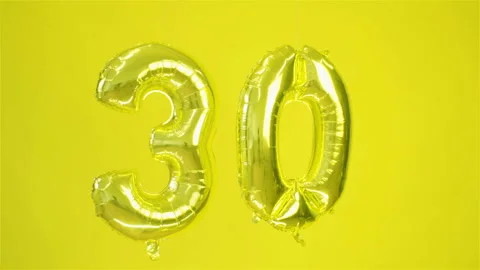 Big golden ball of number thirty on a ye... | Stock Video | Pond5
