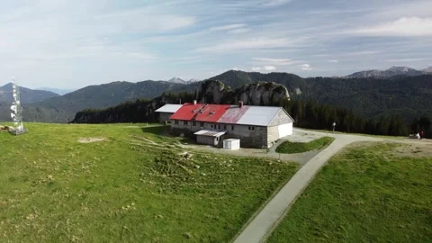 Big hut with a colorful red roof standin... | Stock Video | Pond5