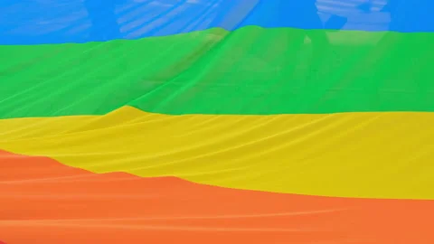 Big rainbow flag waving in slow motion d... | Stock Video | Pond5