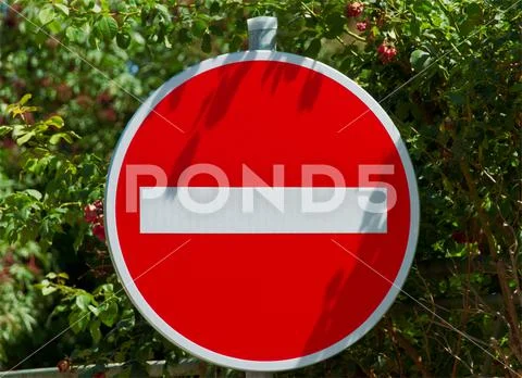 Big red no entry sign on the background of trees ~ Hi Res #146778258