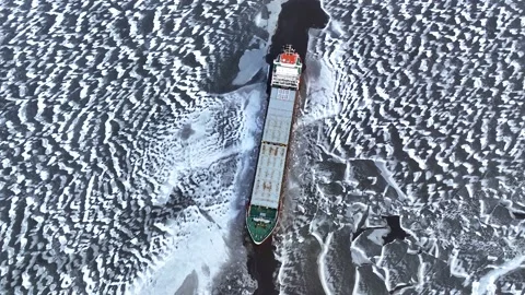 A big red ship frozen in the endless sea... | Stock Video | Pond5