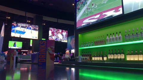Big Screen Tv's Playing Sports in Front ... | Stock Video | Pond5