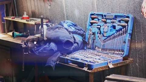 Big set in blue box with mechanic workin... | Stock Video | Pond5
