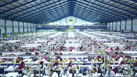 Big sewing machine factory crowded Facto... | Stock Video | Pond5