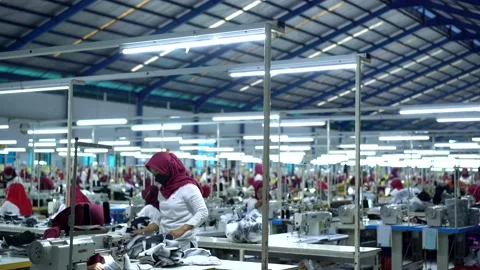 Big sewing machine factory crowded Facto... | Stock Video | Pond5