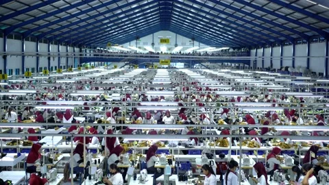 Big sewing machine factory crowded Facto... | Stock Video | Pond5