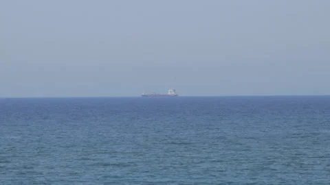 Big Ship at the middle of ocean far away... | Stock Video | Pond5