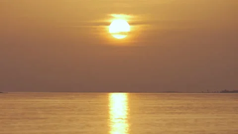Big yellow sun rising over sea surface | Stock Video | Pond5