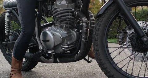 The biker prepares his motorcycle for mo... | Stock Video | Pond5