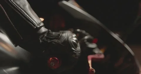 The biker puts his hand on the gas handl... | Stock Video | Pond5