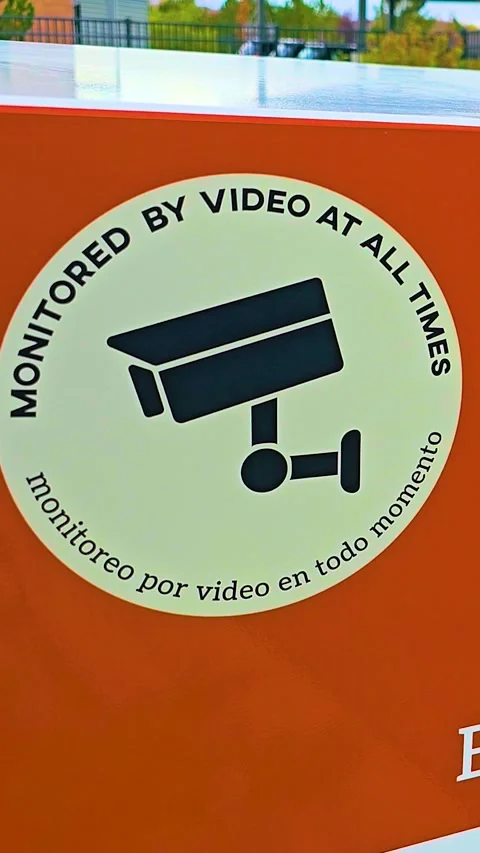 Bilingual CCTV Security Warning Sign on ... | Stock Video | Pond5
