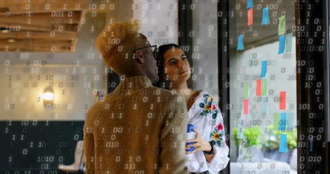 Binary code animation over two people ta... | Stock Video | Pond5