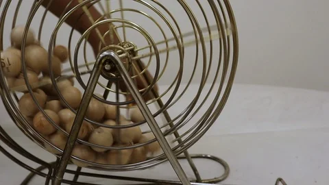 bingo balls rolling around in a cage | Stock Video | Pond5