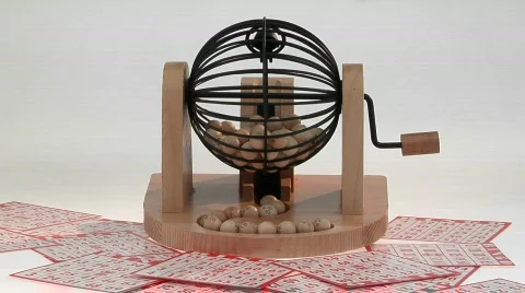 A bingo cage and balls sit on top of bin... | Stock Video | Pond5
