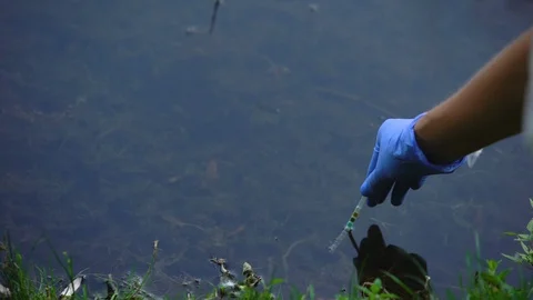 Biologist measuring lake water with heav... | Stock Video | Pond5