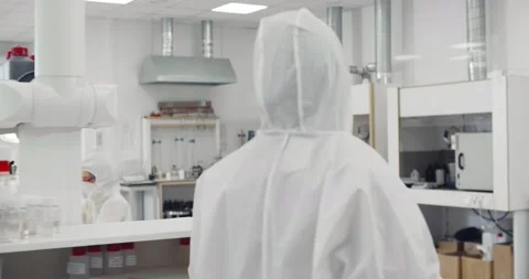 Biotechnology scientist wearing ppe suit... | Stock Video | Pond5