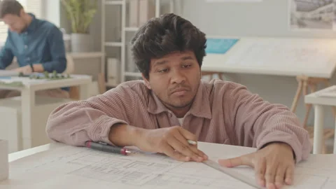 Biracial Architect Drawing Plan in Works... | Stock Video | Pond5