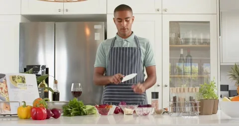 Biracial male cooking vlogger in apron t... | Stock Video | Pond5