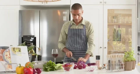 Biracial male cooking vlogger in apron t... | Stock Video | Pond5