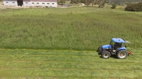 bird eye of tractor mower in operation t... | Stock Video | Pond5