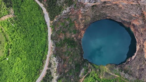 Birds eye view of blue water lake formed... | Stock Video | Pond5