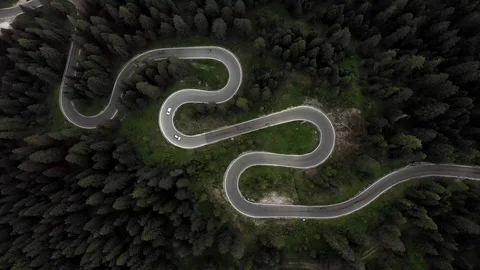 Bird's eye view of cars driving on curvy... | Stock Video | Pond5