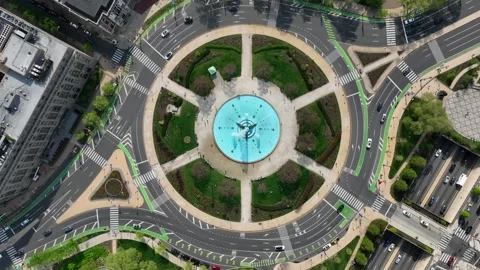 Birds eye view of a fountain. Traffic ci... | Stock Video | Pond5