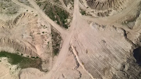 Bird's-eye view over a sand quarry | Stock Video | Pond5
