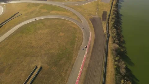 Birds eye view of racing cars turning at... | Stock Video | Pond5
