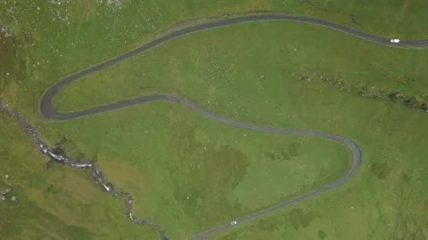 Bird's eye view of a winding road in gre... | Stock Video | Pond5