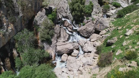 Birth of a river among rocks with pure w... | Stock Video | Pond5