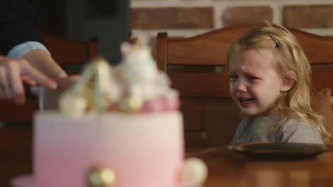 Birthday girl in a bad mood, crying chil... | Stock Video | Pond5