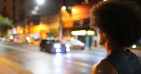 black african man walking at night in do... | Stock Video | Pond5