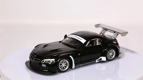 Black BMW scale model sports car is rota... | Stock Video | Pond5