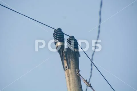 Photograph: Black box silhouette and cable reel. Internet box or ...