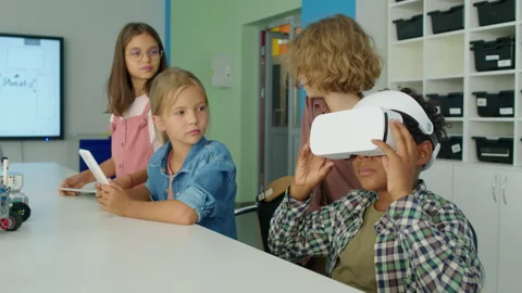 Black Boy with VR Headset Exploring Augm... | Stock Video | Pond5