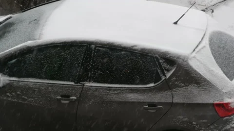 Black car on a winter road in snowfall w... | Stock Video | Pond5